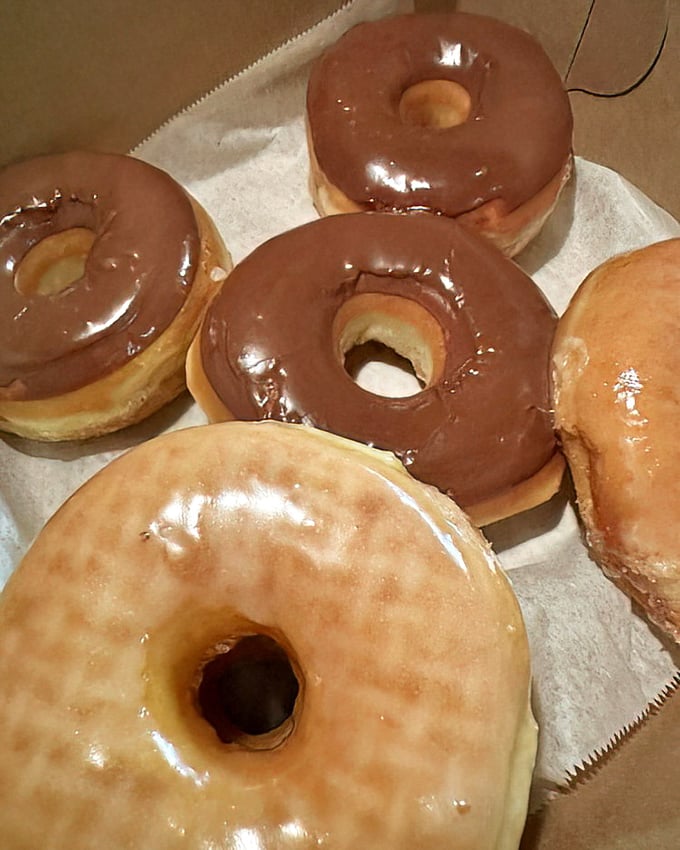 A box of classic donuts is like a family reunion where everyone actually gets along. Chocolate and glazed varieties living in perfect harmony.
