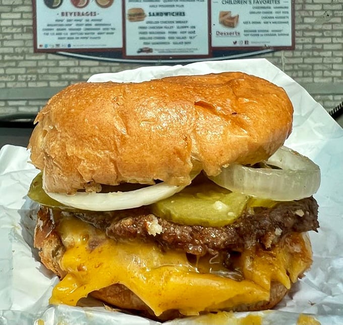 Behold the double cheeseburger in its natural habitat&mdash;melty American cheese cascading over perfectly grilled patties like a dairy waterfall of dreams.