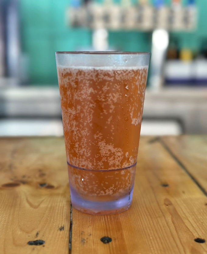 A cold one sweating in the Florida heat &ndash; because even your beer needs air conditioning at The Big Catch.