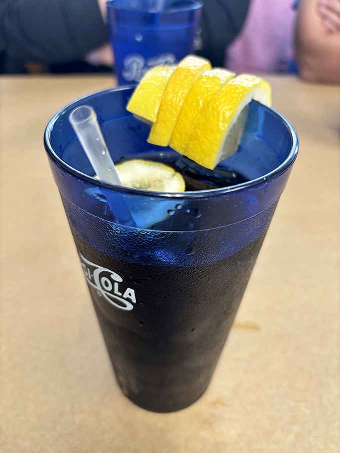 A tall, frosty drink garnished with lemon slices&mdash;the ideal companion for taming the spice of Maryland seafood. 