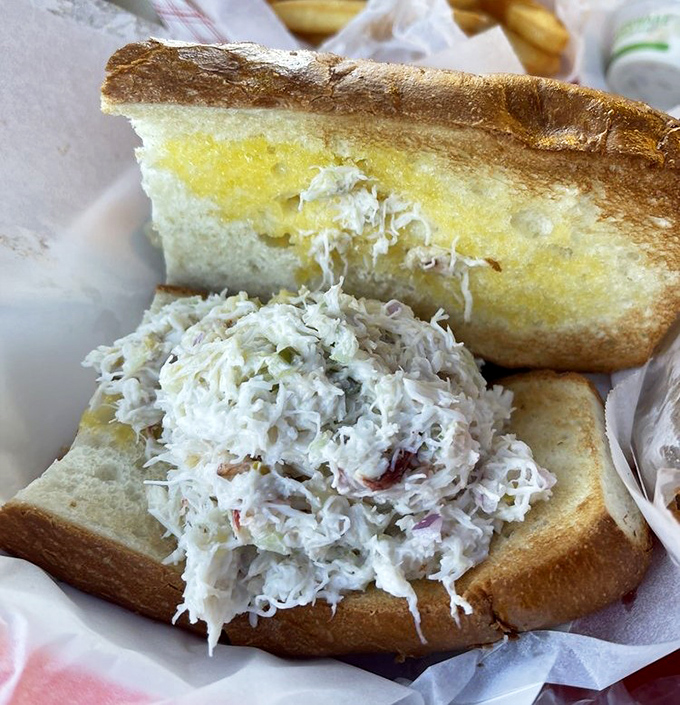 This crab sandwich isn't just a meal&mdash;it's an engineering marvel. Sweet Dungeness crab piled so high it requires strategic planning just to take the first bite.