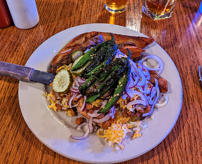 The Eastwood burger arrives with grilled jalape&ntilde;os standing at attention, ready to make your day with every spicy, cheese-laden bite.