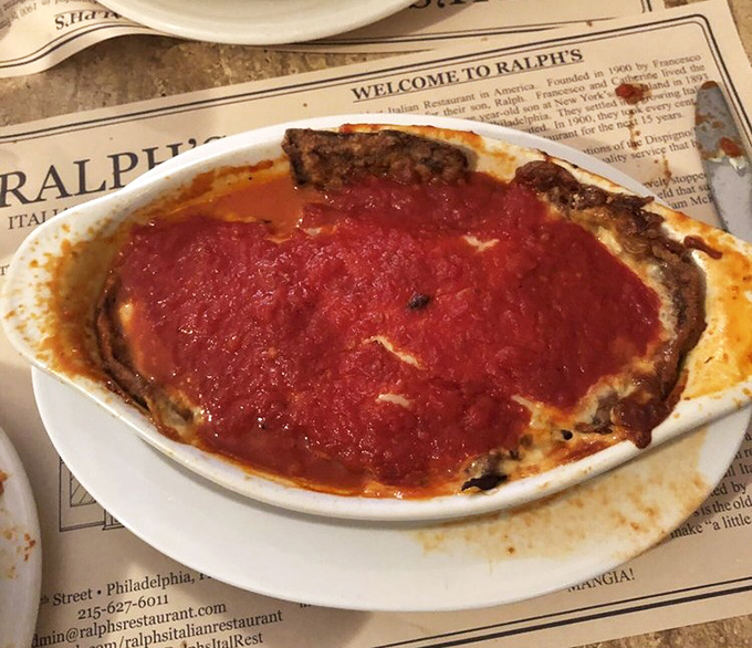 Eggplant parmigiana that could convert carnivores. Layers of melted cheese and tangy sauce transform this humble vegetable into something transcendent.