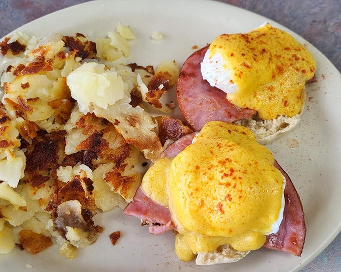 Eggs Benedict done right&mdash;perfectly poached eggs perched atop Canadian bacon with home fries that could make a potato proud.