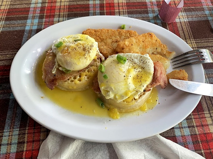 Eggs Benedict with perfectly poached eggs and hollandaise that cascades like a golden waterfall. Breakfast worthy of royalty.