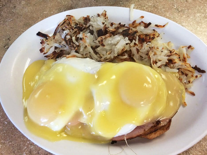 Eggs Benedict done right—perfectly poached eggs, hollandaise that's actually homemade, and hash browns crisped to golden perfection.