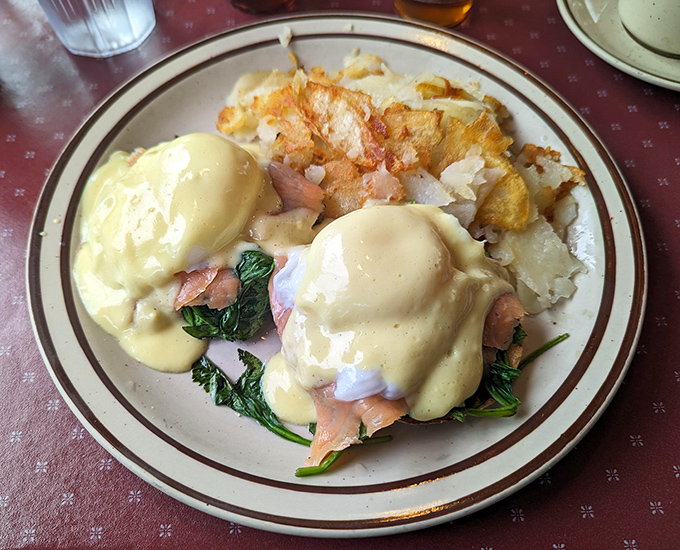 Eggs Benedict done right &ndash; with velvety hollandaise cascading down like a yellow waterfall of breakfast bliss. Worth getting out of bed for.