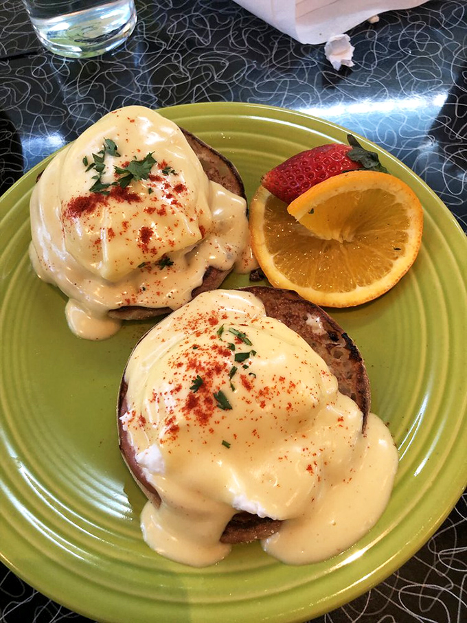Eggs Benedict that's dressed for success with perfectly poached eggs, hollandaise that's sunshine-yellow, and a side of vitamin C for good measure.