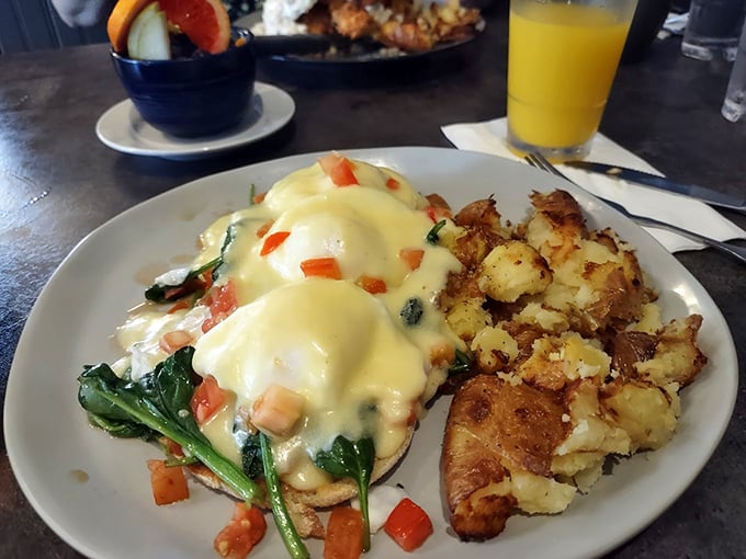 Benedict done right is poetry on a plate. Hollandaise cascading over perfectly poached eggs with spinach and tomato&mdash;a morning masterpiece worth the wait.