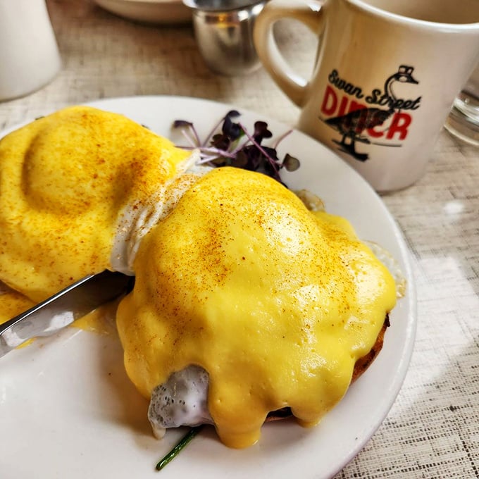 Eggs Benedict draped in hollandaise so rich it could retire early and live comfortably in Florida.