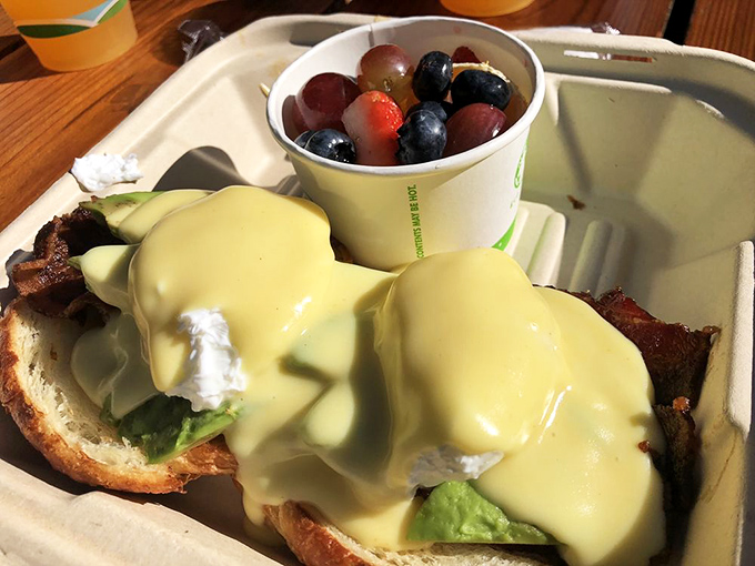 Eggs Benedict: where hollandaise dreams come true and avocado makes everything better, like a breakfast hug on a plate.
