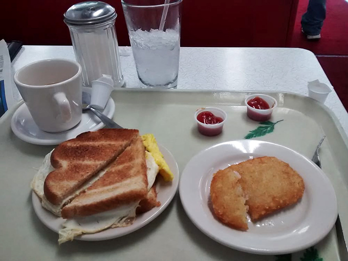 Breakfast perfection doesn't need to be complicated. This egg sandwich and hash brown combo proves that morning magic happens on the simplest of plates.
