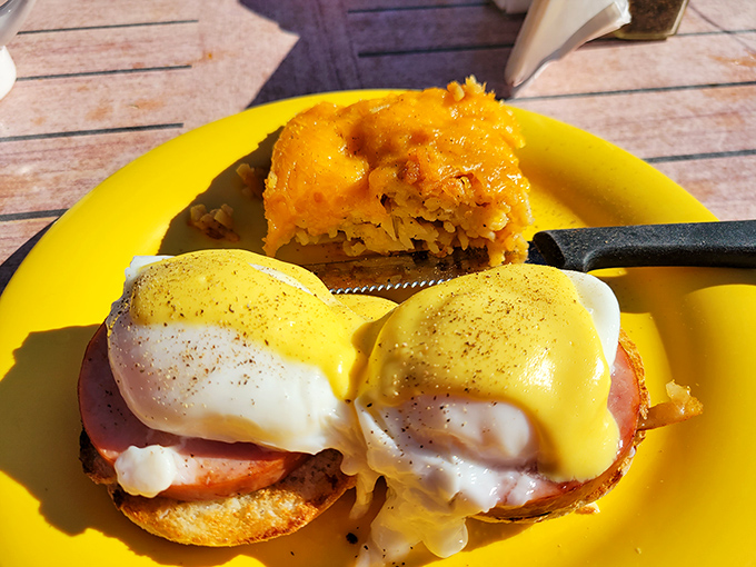 Eggs Benedict: where perfectly poached eggs meet hollandaise in a romance more satisfying than any Hollywood ending. That cornbread side isn't just a wingman&mdash;it's a star.