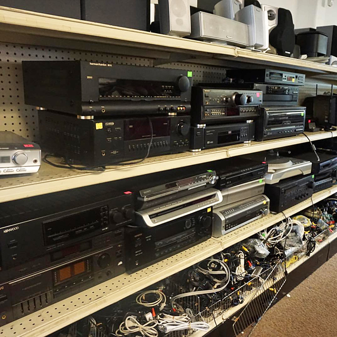 Vintage electronics that survived the digital revolution stand at attention, reminding us when stereo components were furniture-worthy statement pieces.