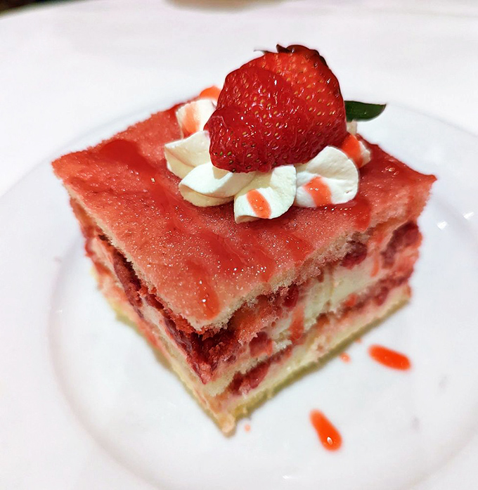 This strawberry dessert brings a sweet finale to the meat-centric symphony. That delicate layering is what happens when pastry chefs take their craft seriously.