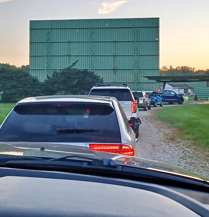 The pre-show pilgrimage &ndash; cars lined up at dusk, each filled with viewers eager for that perfect parking spot with unobstructed screen views.