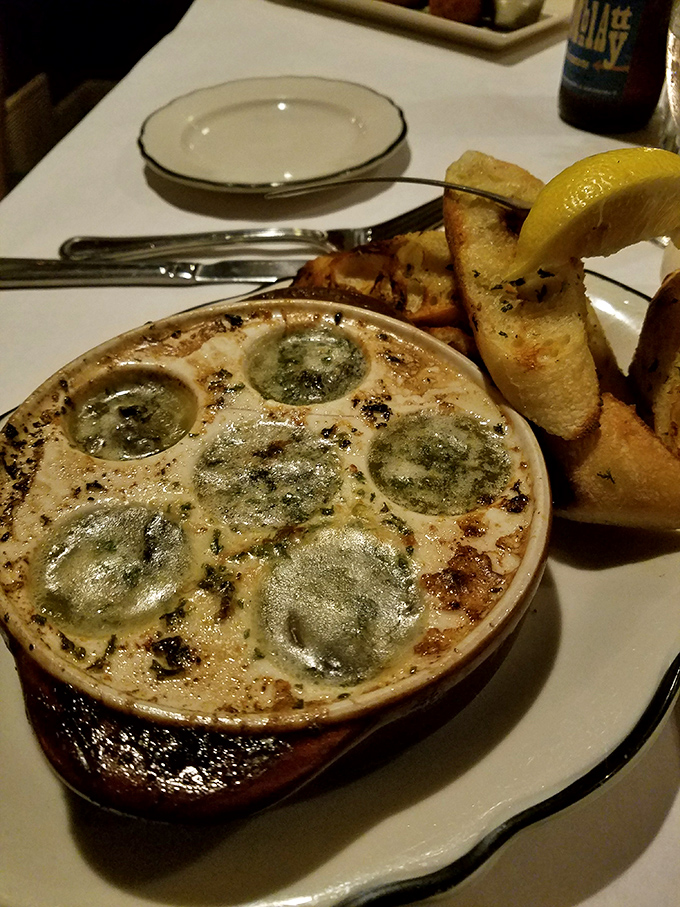 Escargot that would make Julia Child nod in approval, bubbling with garlicky butter and begging for that crusty bread to soak up every last drop.