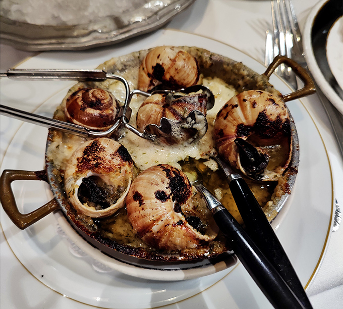 Escargot that would make a Frenchman homesick. Bathed in garlic butter and herbs, these little flavor bombs turn the unfamiliar into the unforgettable.