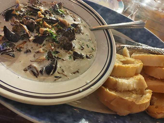 Escargot that would make Julia Child nod in approval. Swimming in garlicky, buttery goodness with crusty bread standing by for essential sauce-sopping duties.