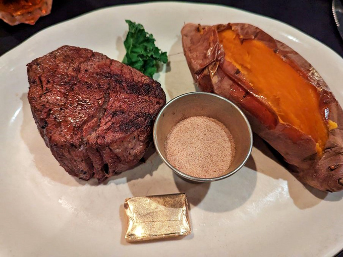 Filet mignon with sweet potato and seasoning on the side&mdash;proof that sometimes the simplest preparations let truly great ingredients shine brightest.