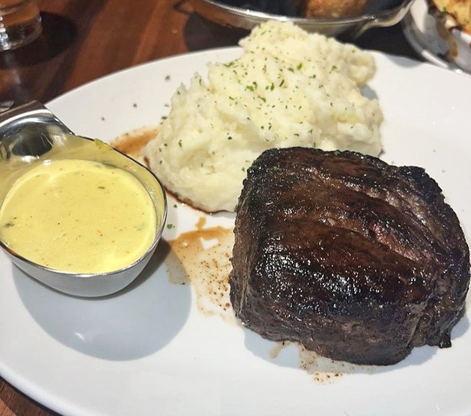 A filet mignon with the perfect sear, accompanied by whipped potatoes so fluffy they could float away if not anchored by that heavenly sauce. 