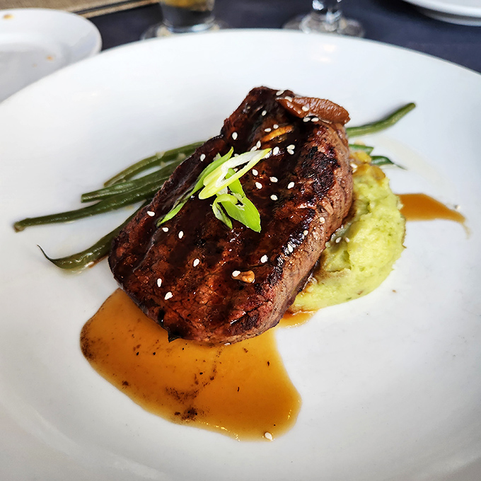 A steak so perfectly cooked it makes you wonder if the chef has some sort of meat telepathy. Those grill marks don't lie.