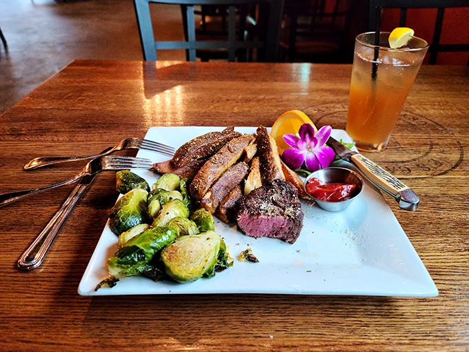 A steak that's dressed for success &ndash; the ribeye arrives with Brussels sprouts and a flower garnish that says "fancy, but not pretentious."