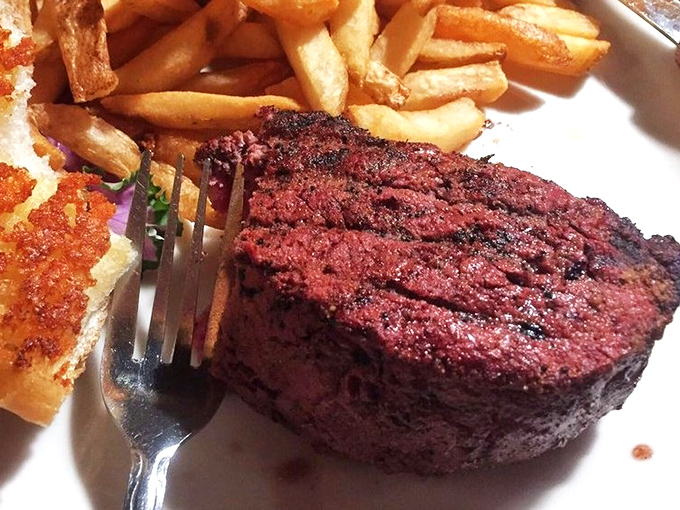 A filet mignon that's dressed better than most people at prom. That perfect sear is the tuxedo; the medium-rare center is the soul of the party.