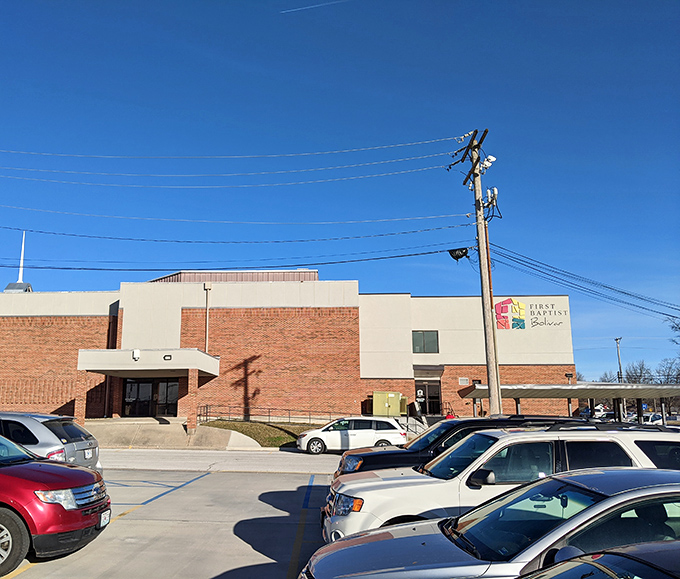 Solid brick churches anchor neighborhoods like reliable friends, offering comfort, community, and Sunday morning coffee fellowship traditions.