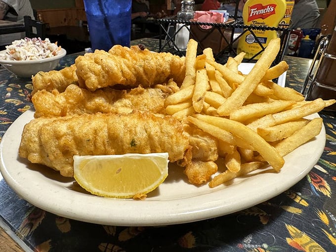 Fish and chips so golden and crispy, they make the British version seem like it needs swimming lessons. That lemon wedge isn't just for show.