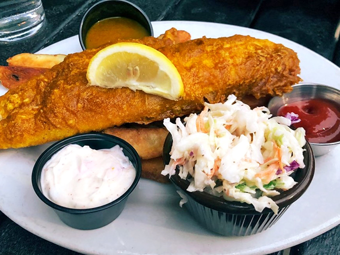 Fish and chips done right &ndash; crispy golden batter shattering at first bite to reveal flaky white fish. The coleslaw and tartar sauce are just supporting actors in this British classic.