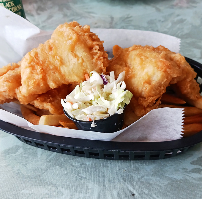 Golden-fried fish that's crispy enough to make you forget your diet resolutions. The coleslaw provides the illusion of healthiness we all need.