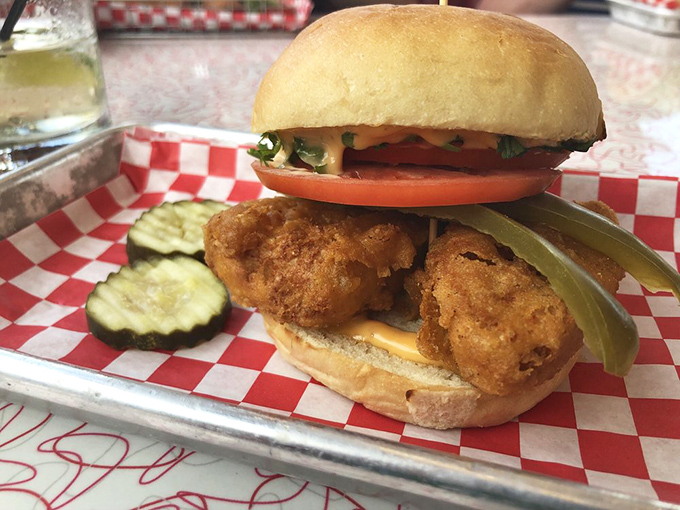 This isn't just a sandwich; it's a masterpiece of crispy, golden perfection nestled between pillowy buns.