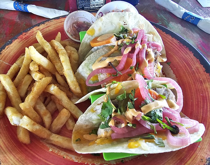 Fish tacos that tell the story of the ocean in every bite, with those pickled red onions adding the perfect plot twist.