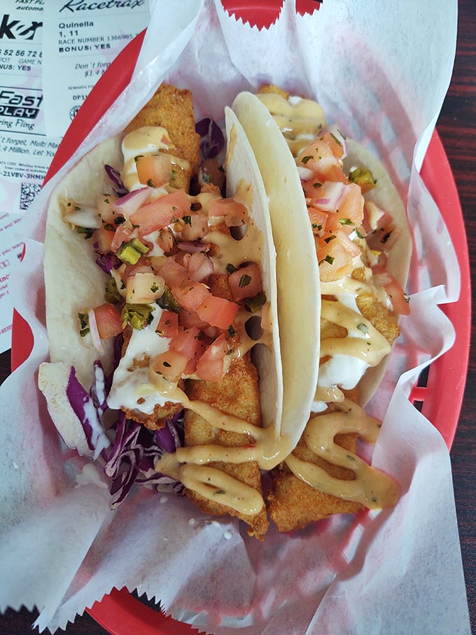 Fish tacos that bring the beach to you &ndash; crispy fish, fresh slaw, and a drizzle of sauce that ties it all together like a culinary bow.