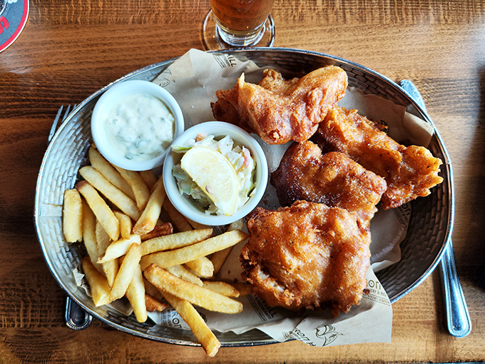 Fish and chips that transport you to an English seaside without the dreary weather. The perfect golden ratio of crisp batter to flaky fish.