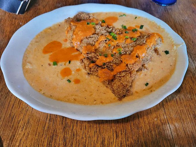 Southern comfort meets Philadelphia ingenuity. This crispy delight swimming in velvety sauce proves that breakfast can indeed be art.