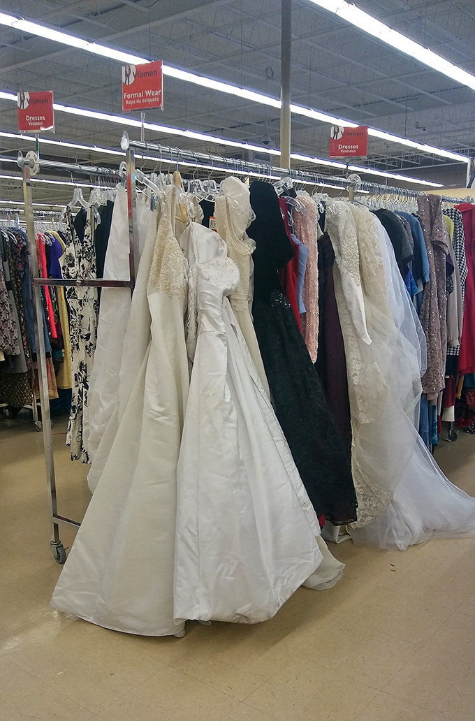 Wedding dresses hanging like elegant ghosts of celebrations past, ready for new "I do" moments at fraction-of-retail prices.