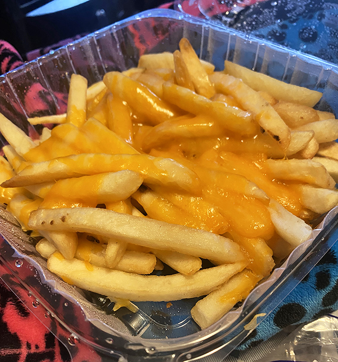Golden, crispy fries bathed in melted cheese&mdash;proof that sometimes the simplest pleasures are worth every single calorie.
