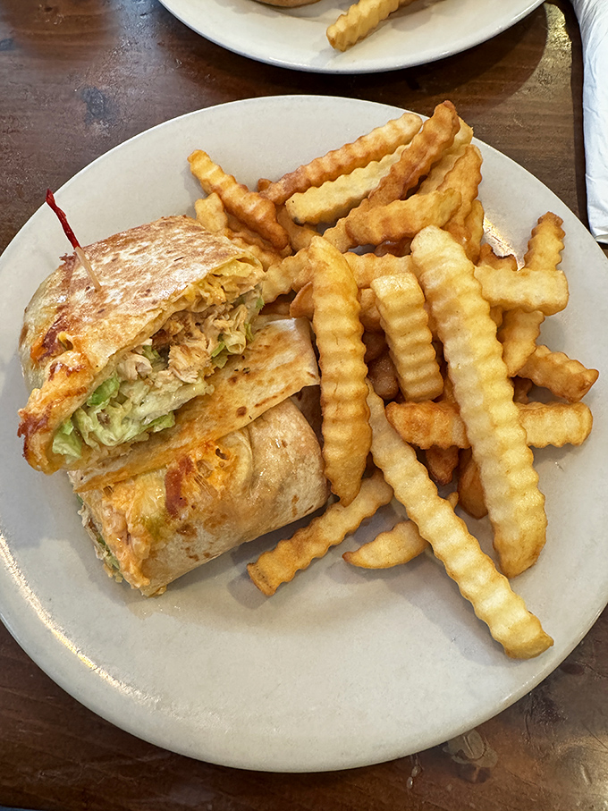 This chicken wrap with crinkle-cut fries isn't just lunch&mdash;it's therapy on a plate. Notice how they're perfectly arranged for maximum dipping potential.