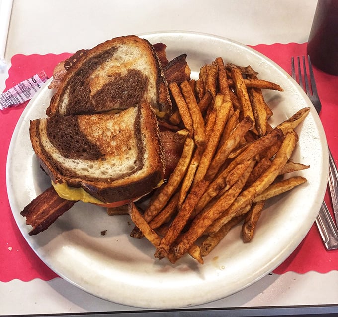 A grilled sandwich with fries that doesn't need a fancy name or truffle oil to make you temporarily forget all your adult responsibilities.