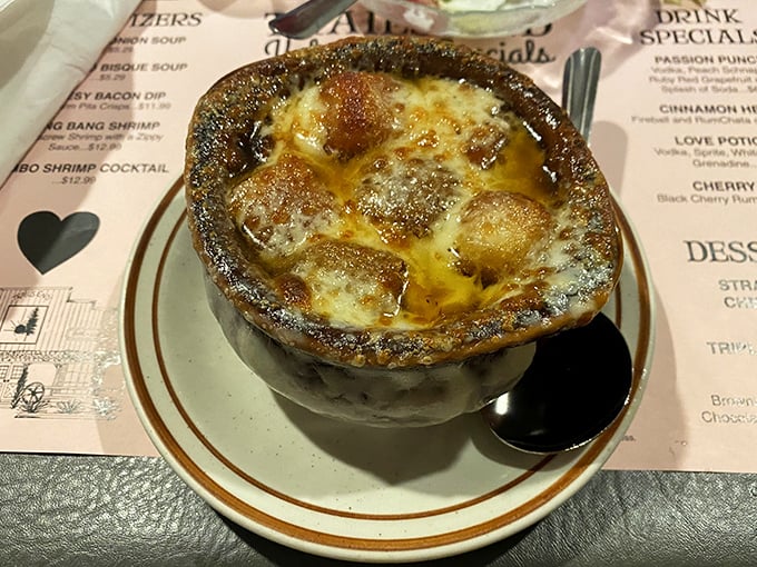Bubbling French onion soup crowned with melted cheese creates the kind of warmth that heals winter souls.