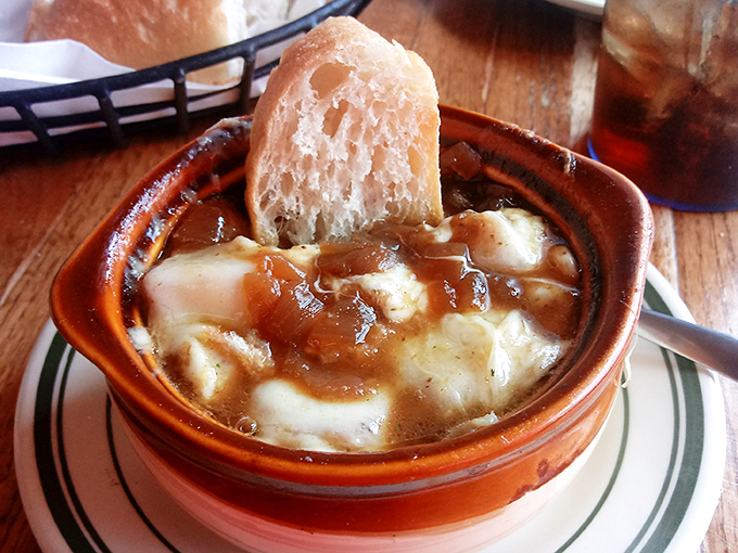 French onion soup that's worth the cheese pull. Caramelized onions swimming beneath a melty provolone blanket with a crusty bread island&mdash;soup nirvana achieved.