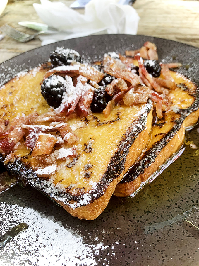 French toast that's had more thought put into it than most people's retirement plans. Those berries aren't garnish&mdash;they're co-stars.