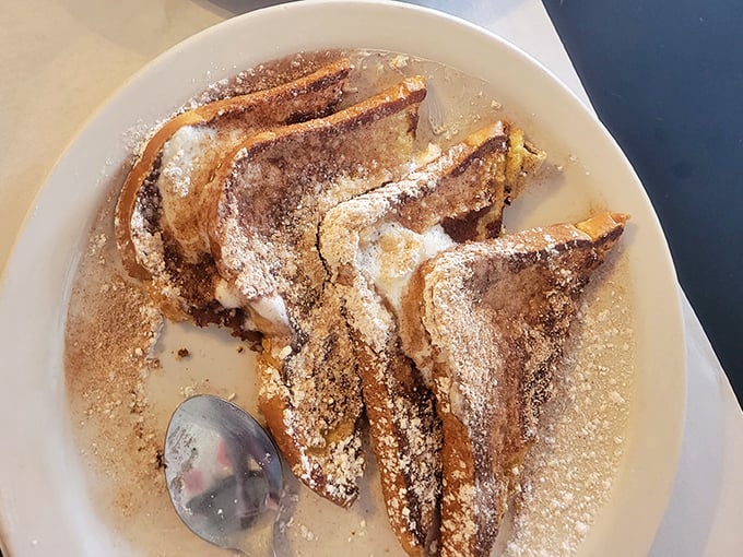 French toast dusted with powdered sugar like fresh snow on Christmas morning&mdash;simple perfection that needs no gimmicks.