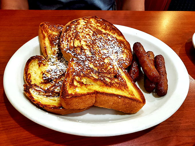 French toast that makes ordinary bread feel special&mdash;dusted with powdered sugar like the first perfect snowfall of winter. Those sausages aren't just along for the ride.
