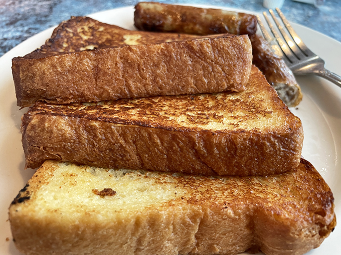 French toast so golden and perfect it belongs in Fort Knox, not just on your breakfast plate.