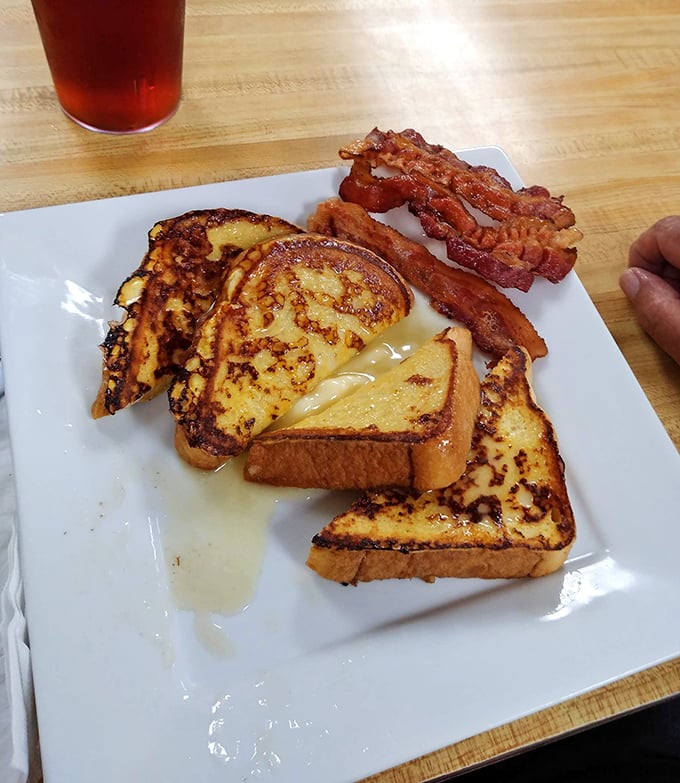 French toast that achieves the golden trifecta: crispy edges, custardy center, and just enough maple syrup to make Monday feel like Saturday.