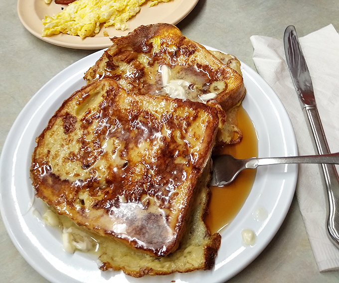 French toast that makes bread fulfill its highest purpose. Soaked, griddled, and swimming in syrup &ndash; breakfast's answer to dessert.