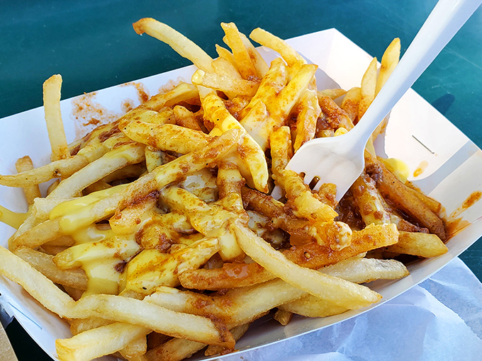 Chili cheese fries that don't apologize for being exactly what they are: a glorious, melty celebration that transforms the humble potato into art.